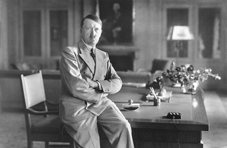 Adolf Hitler sitting on the edge of a desk at h.. | Köp på Tradera ...