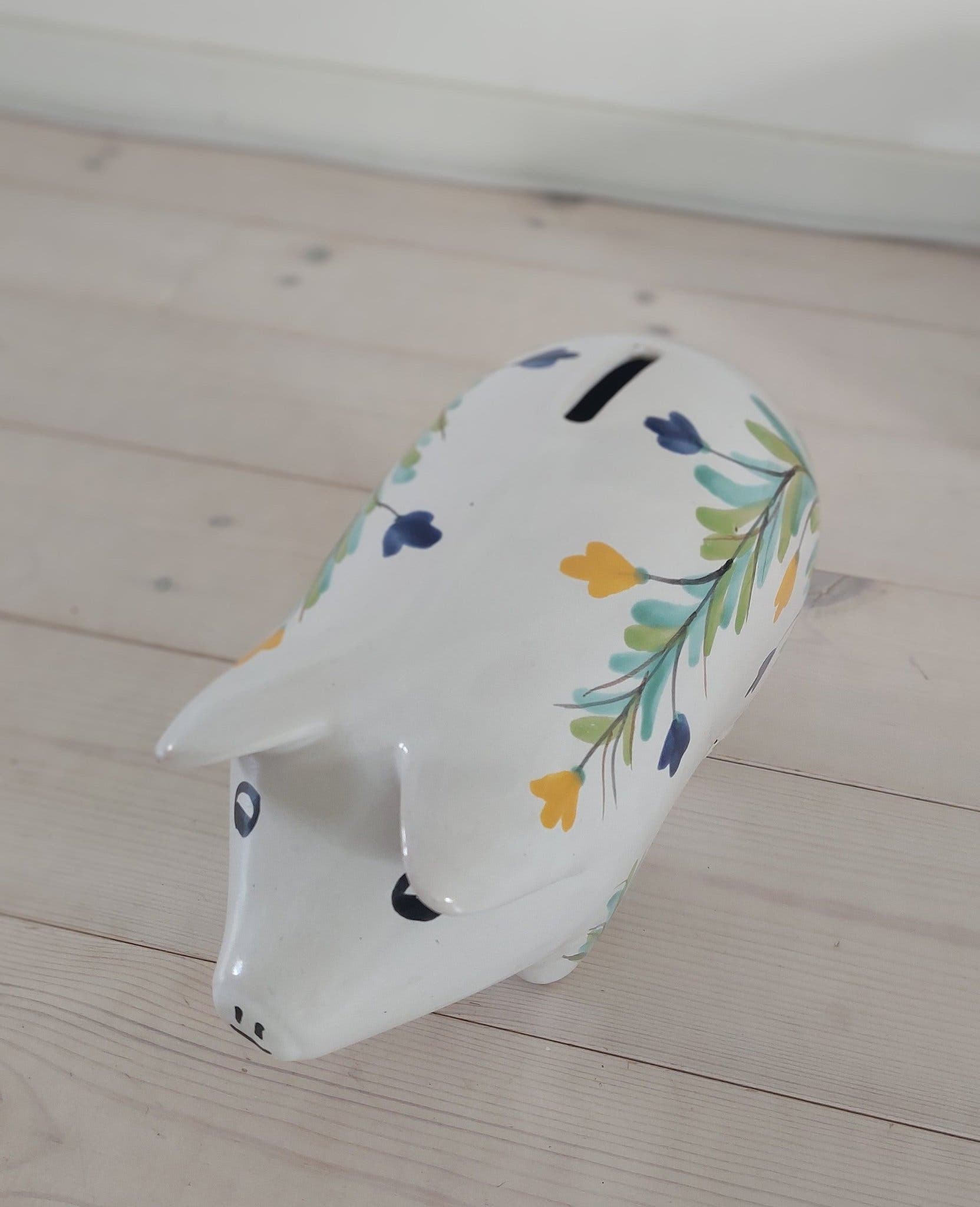 Se produkter som liknar Blommig spargris i keramik fr.. på Tradera ...