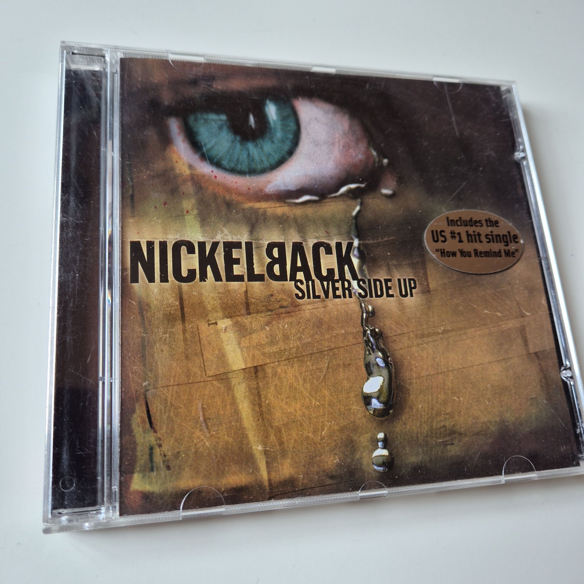 Se produkter som liknar Nickelback - Silver Side Up C.. på Tradera ...
