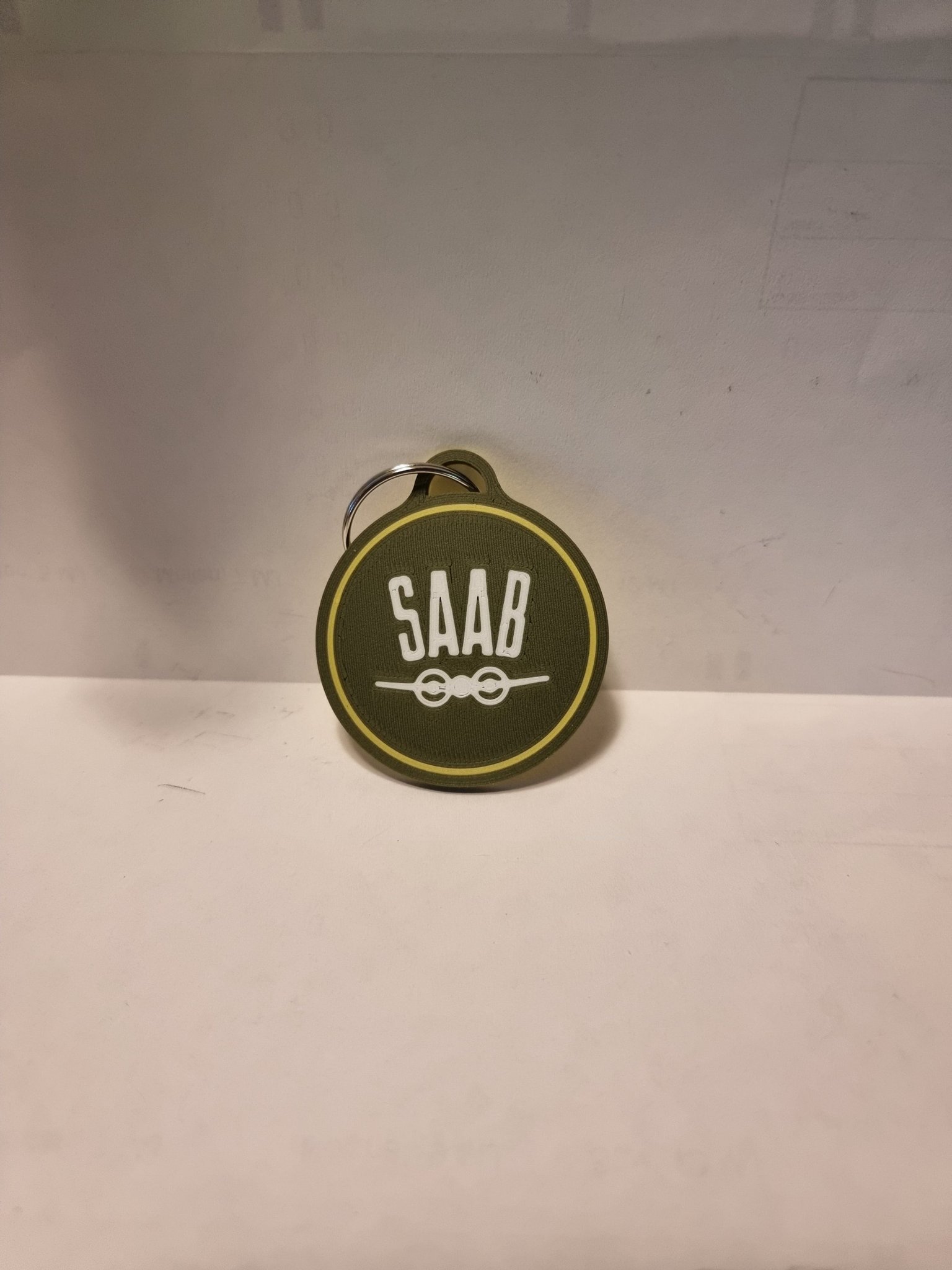 Nyckelring Saab Logga Grön/Gul | Köp på Tradera (691327292)